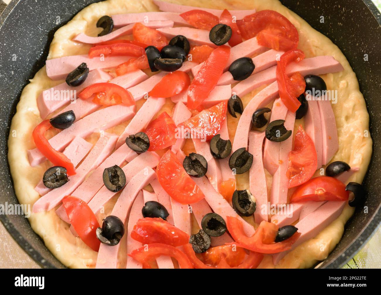 Homemade pizza with tomatoes, cheese and sausage Stock Photo - Alamy