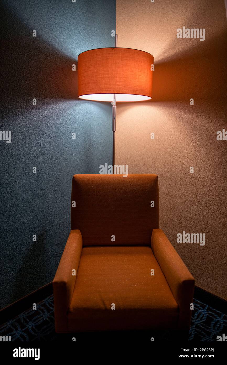 Lonely bold colored chair in corner Stock Photo - Alamy