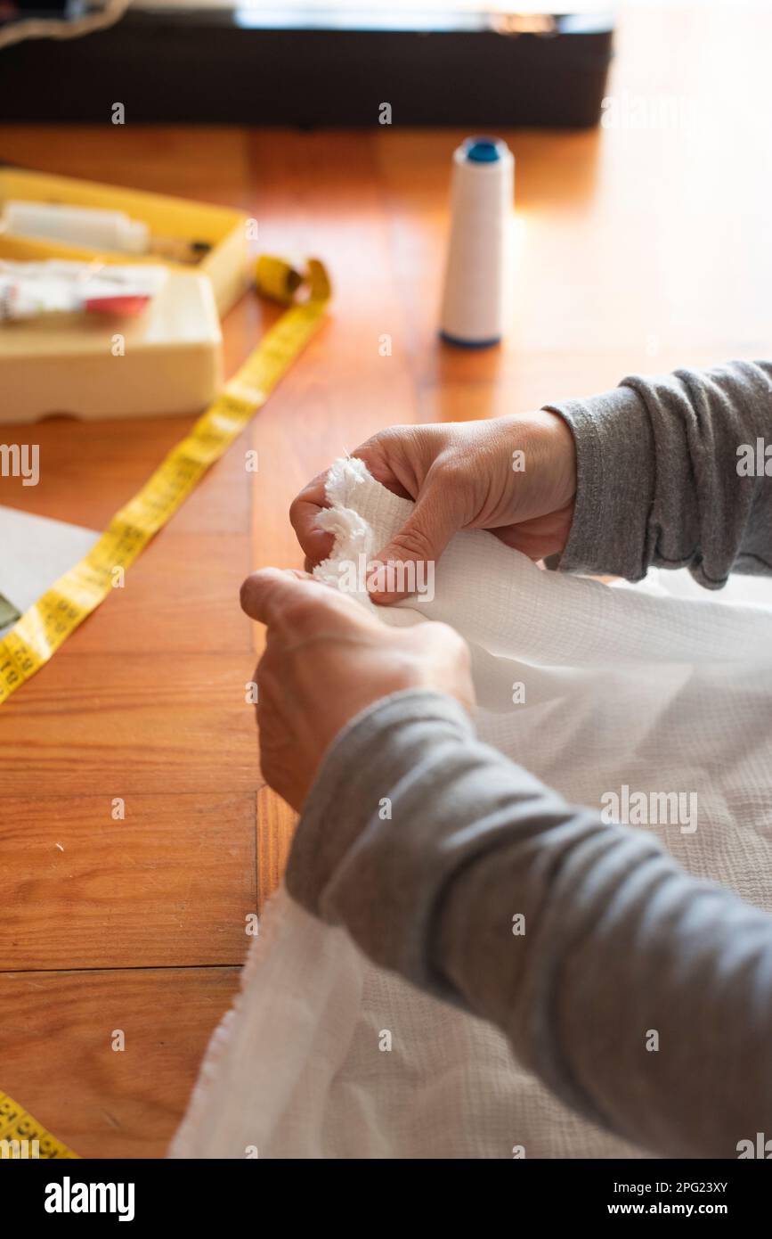 garment sewn by hand using sewing tools Stock Photo - Alamy