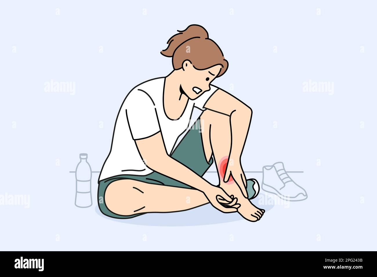 Unhealthy woman sit on floor in gym touch hurt ankle. Unwell girl ...