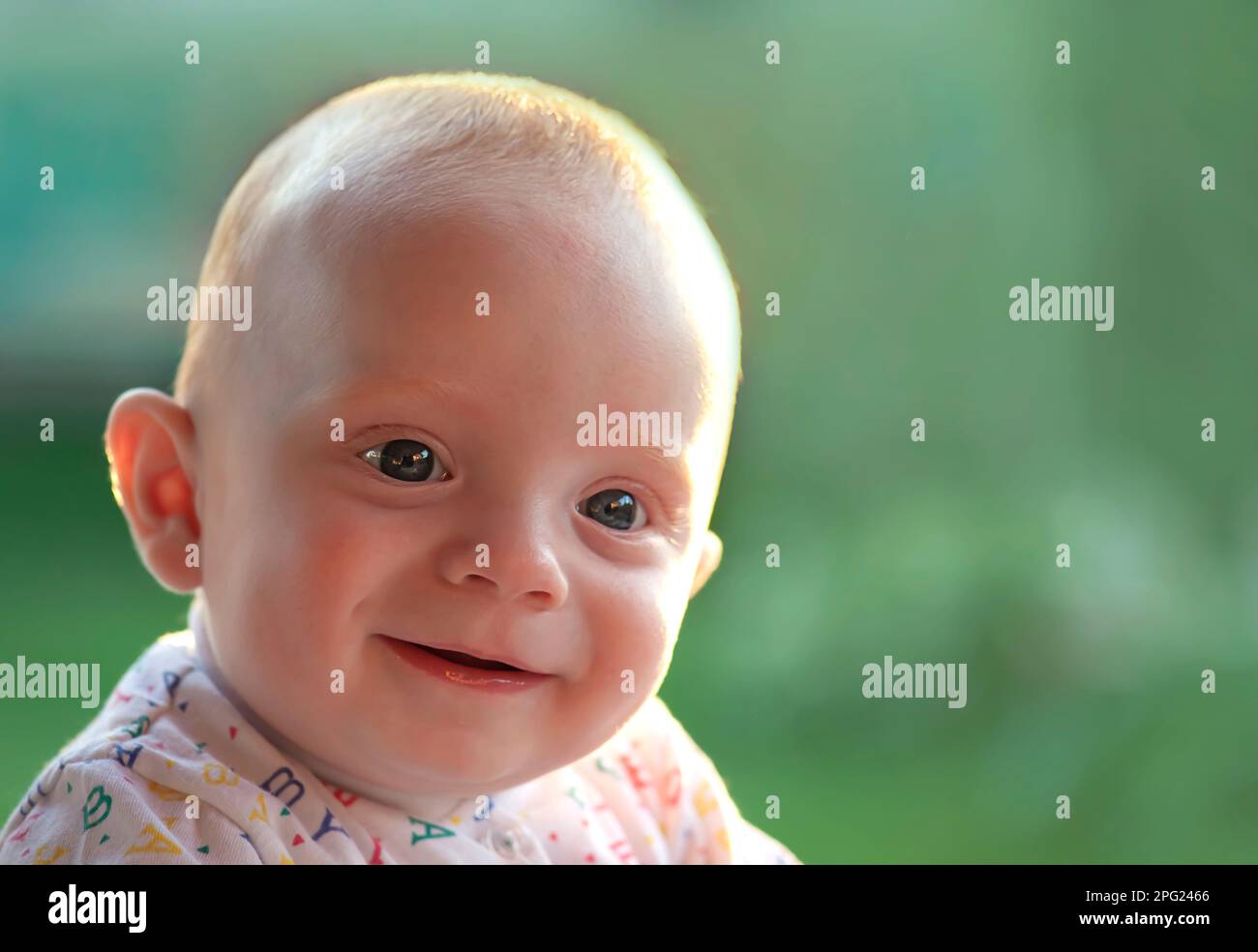 The little boy smiles happily Stock Photo - Alamy
