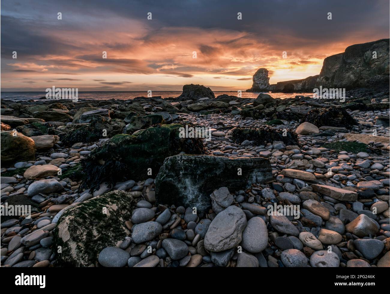 Dramatic low angle dawn seascape at Marsden Beach in North East England ...