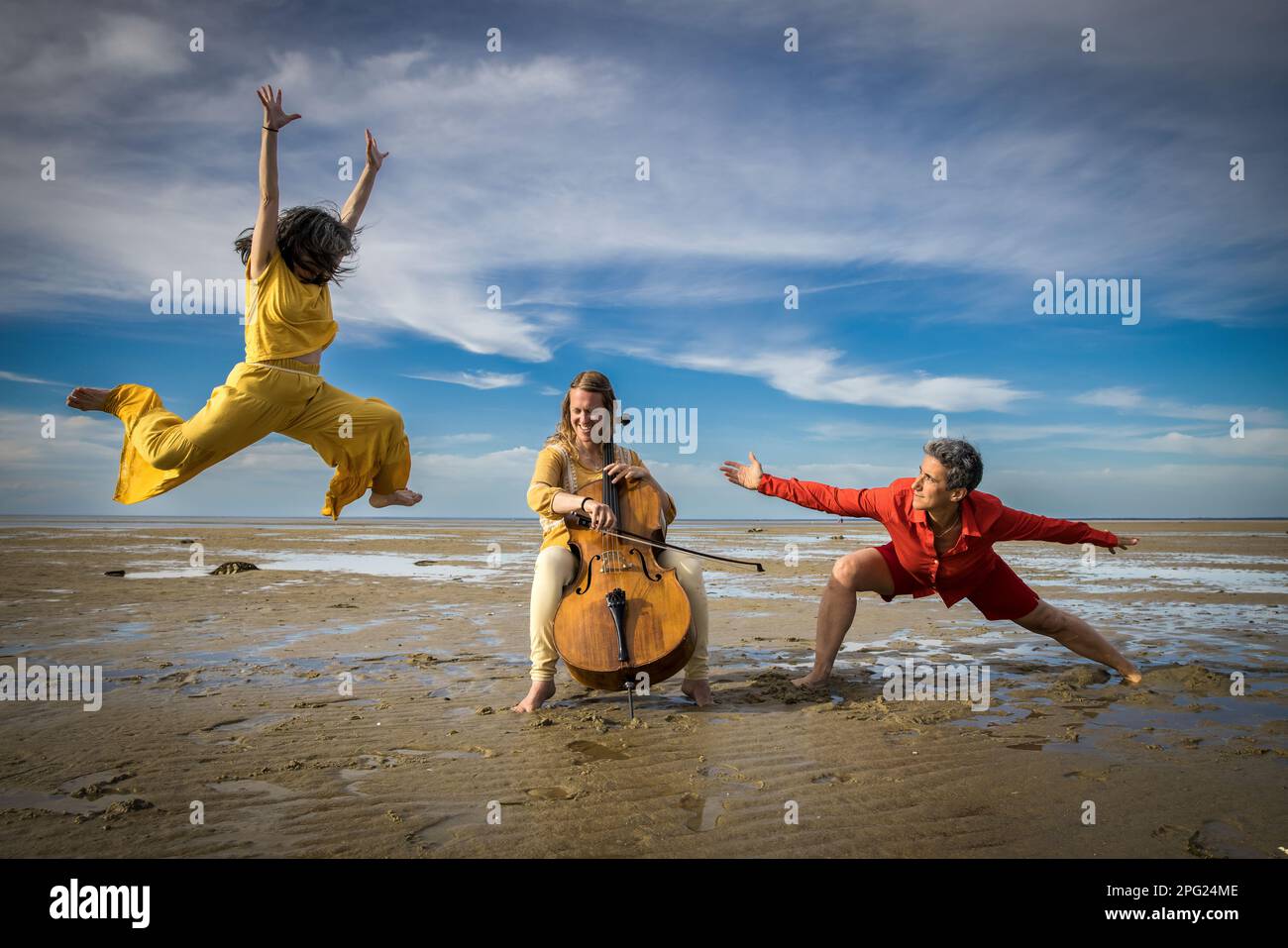 dancers and cellist performing on Cape Cod beach Stock Photo - Alamy