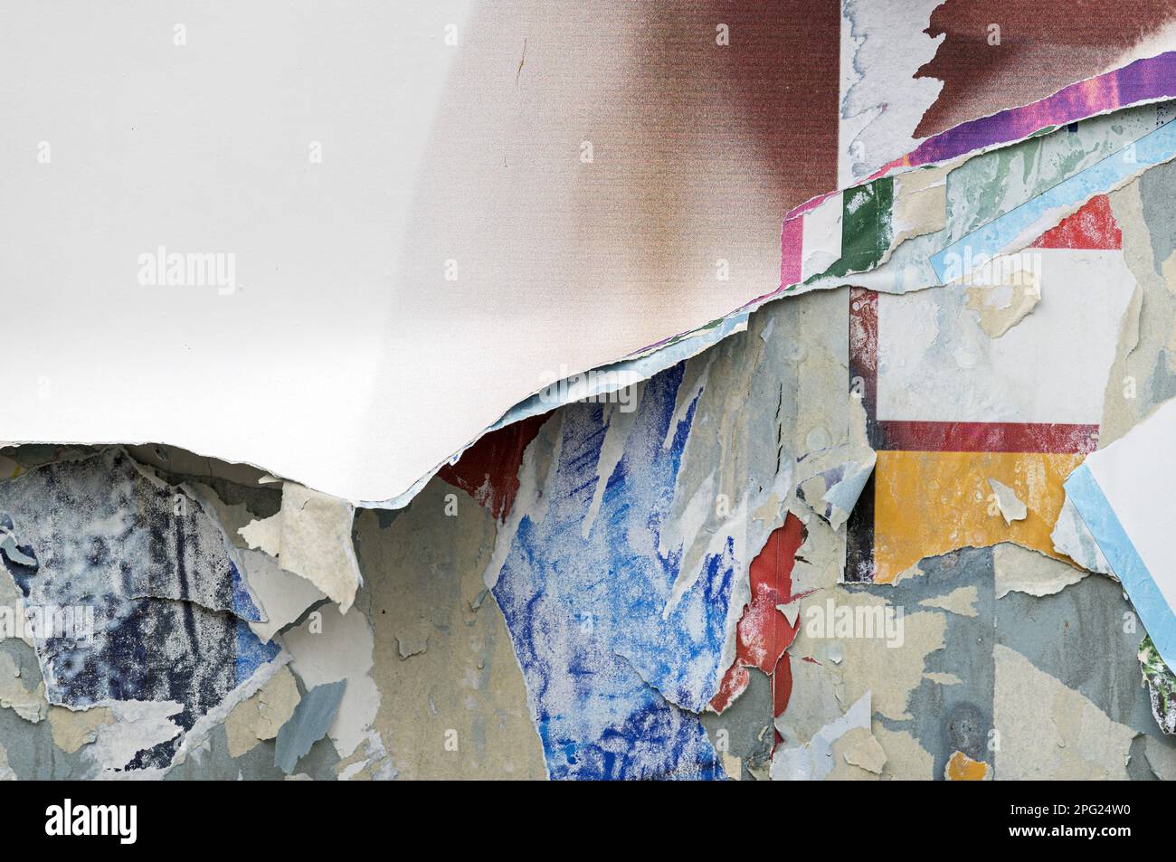 Shabby poster paper background. Vintage billboard with torn ads as ...