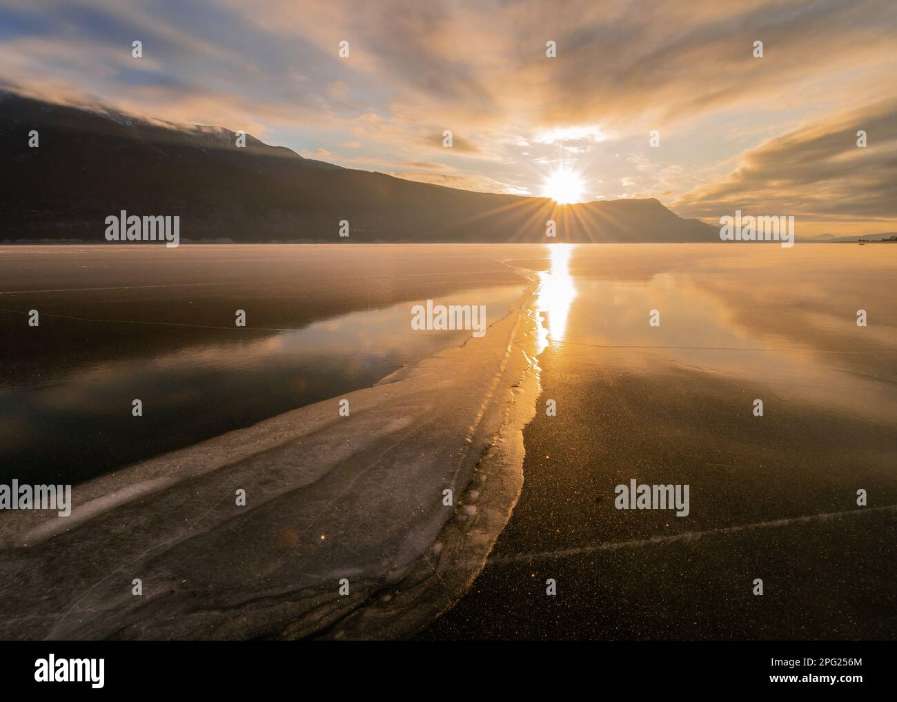 Sun Reflection on Frozen Lake Stock Photo - Alamy