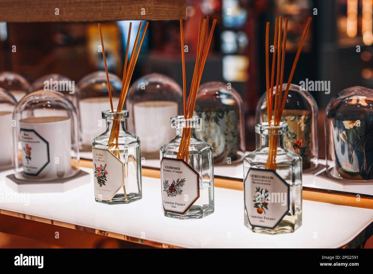 Aroma diffuser wooden sticks in the glass transparent bottle. Cozy home ...