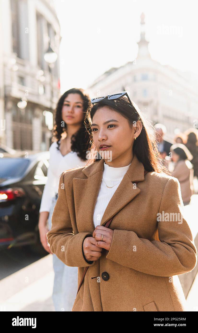 Stock photo of a profile shot of two friends standing Stock Photo - Alamy