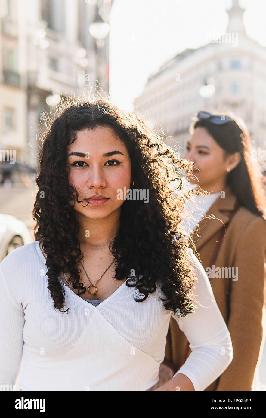 Stock photo of a profile shot of two friends standing Stock Photo - Alamy