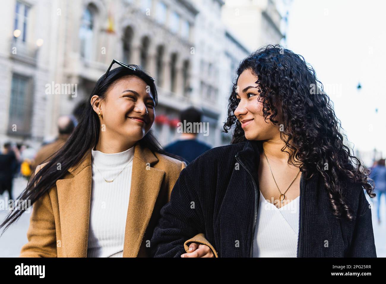 stock photo of two happy friends visiting the city Stock Photo - Alamy