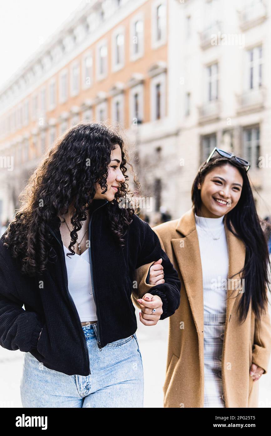 stock photo of two happy friends visiting the city Stock Photo - Alamy