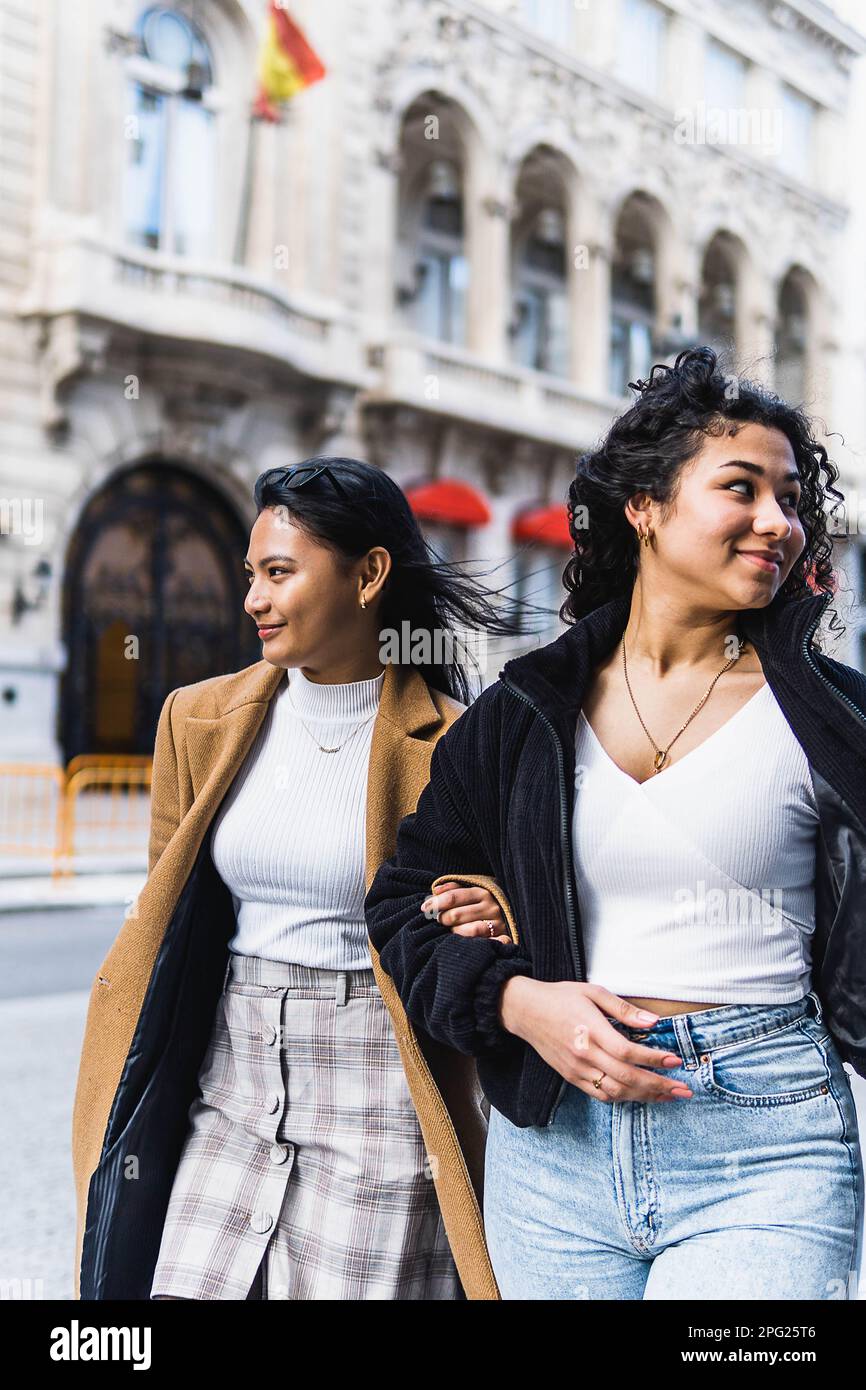 stock photo of two happy friends visiting the city Stock Photo - Alamy