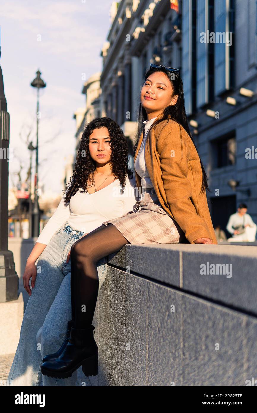 Stock photo of two friends with sunlight. Models posing Stock Photo - Alamy