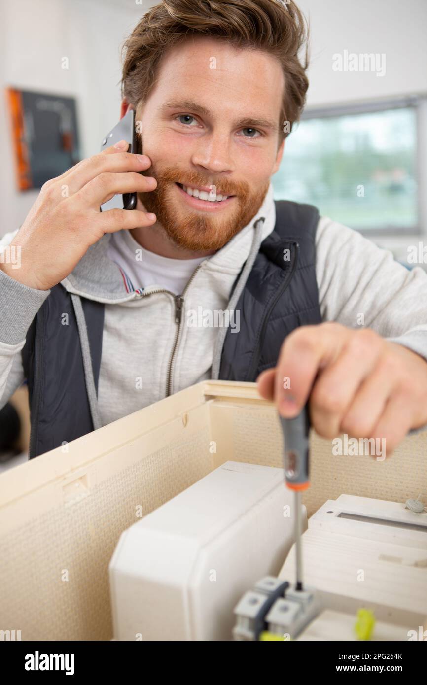 Technician checking phone circuit hi-res stock photography and images ...