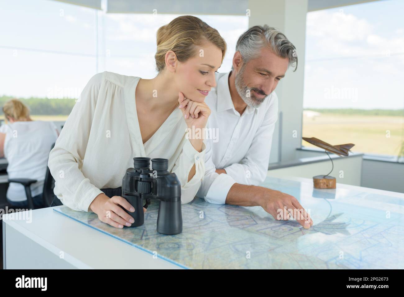 workers in an airport control tower Stock Photo - Alamy