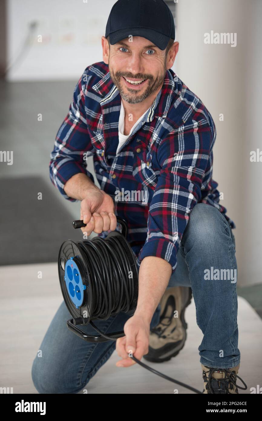 man working with cables Stock Photo - Alamy