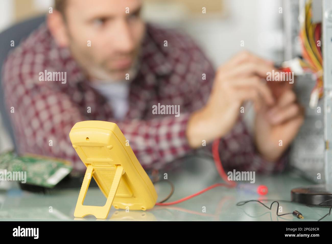 a technician is testing cpu current Stock Photo - Alamy