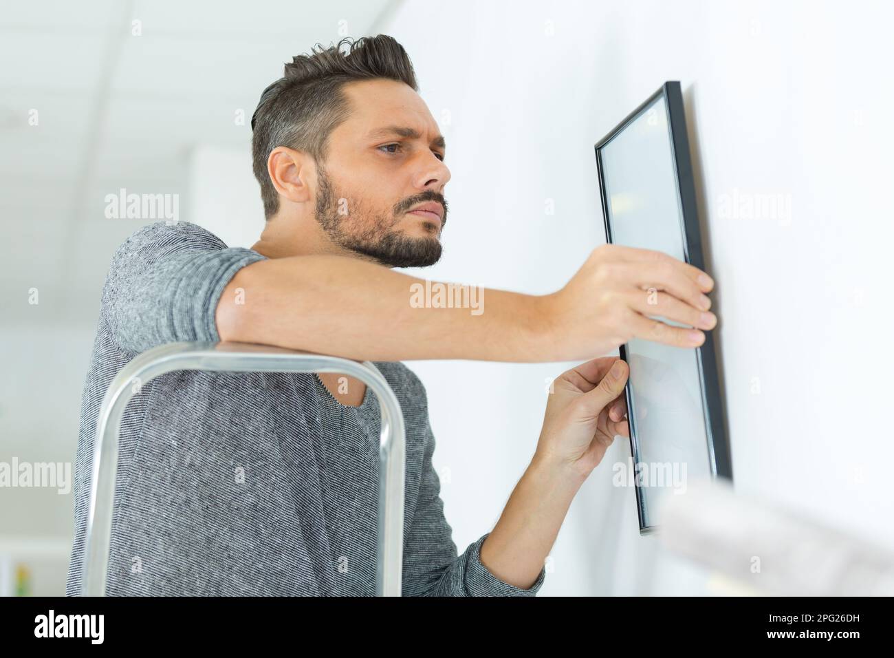 installation of a frame Stock Photo - Alamy