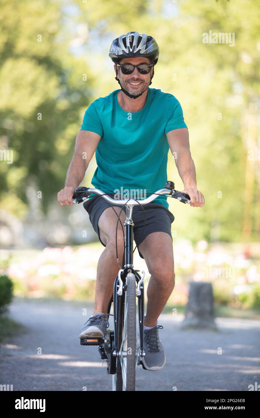 Attractive man cycling hi-res stock photography and images - Alamy