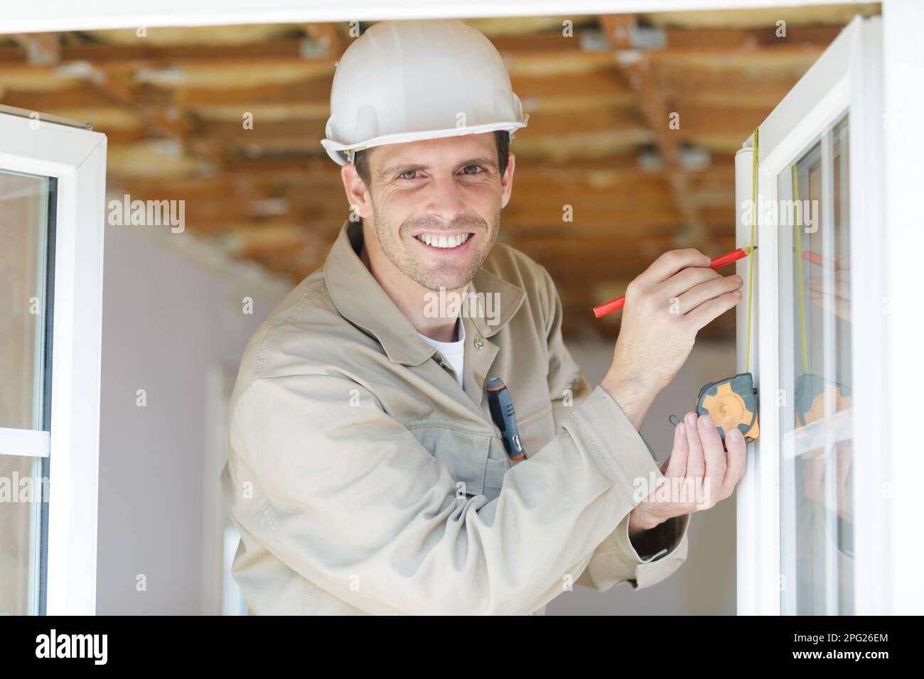 window builder working on mount of new installation Stock Photo - Alamy