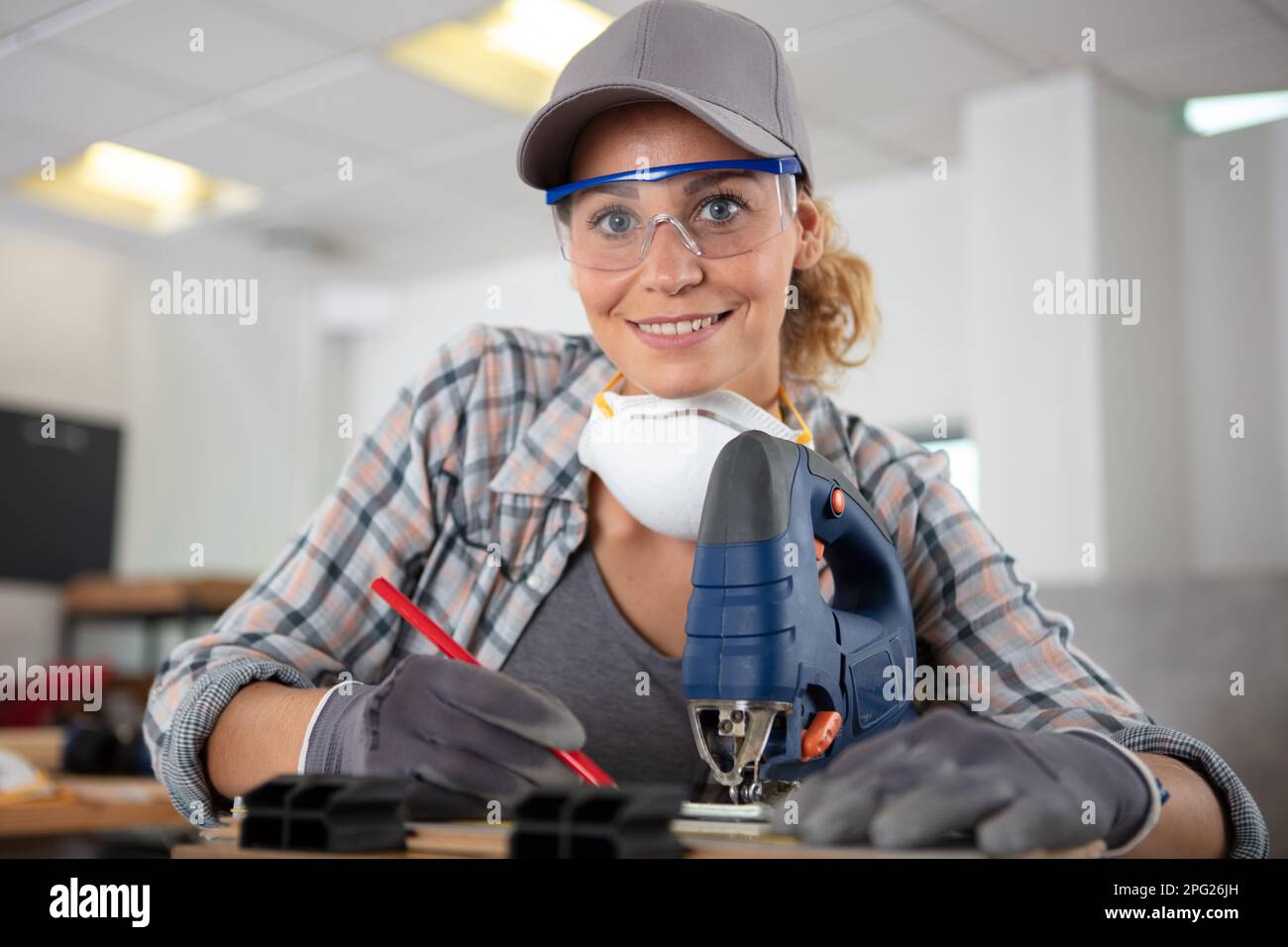 female woodworker posing smiling in workshop Stock Photo - Alamy