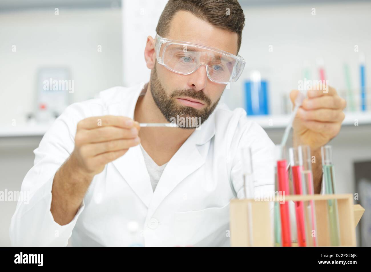 young biologist sets dna sequencing reaction with multichannel pipette ...