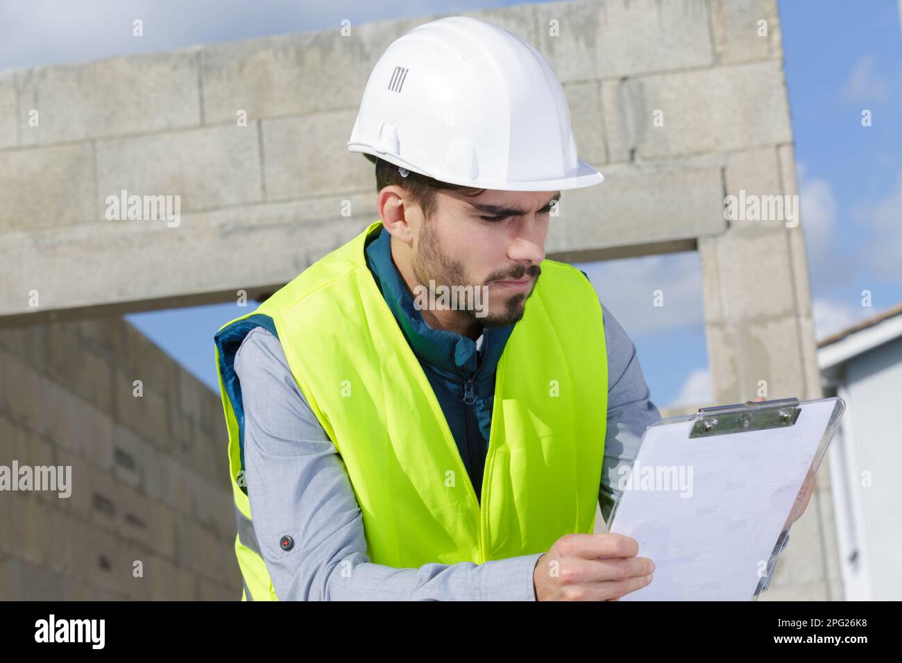 construction manager writing report at construction site Stock Photo ...