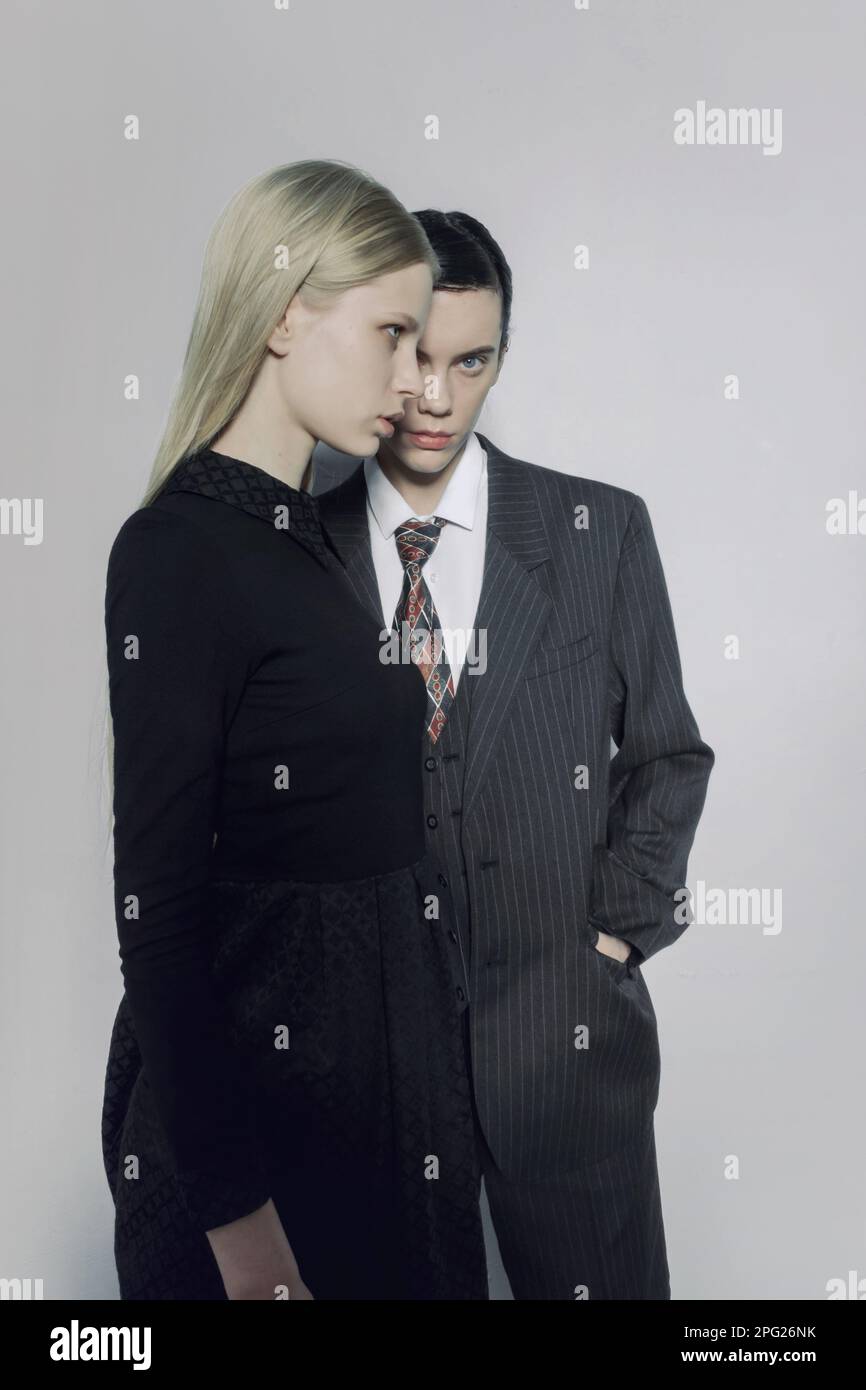 Women on gray background, masculine and feminine Stock Photo - Alamy