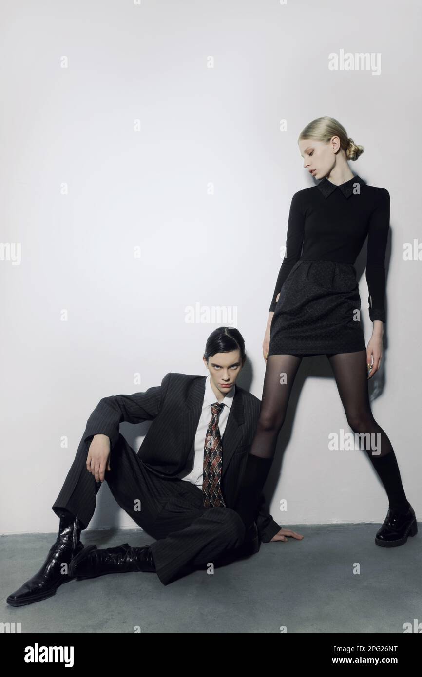 Women on gray background, masculine and feminine Stock Photo - Alamy