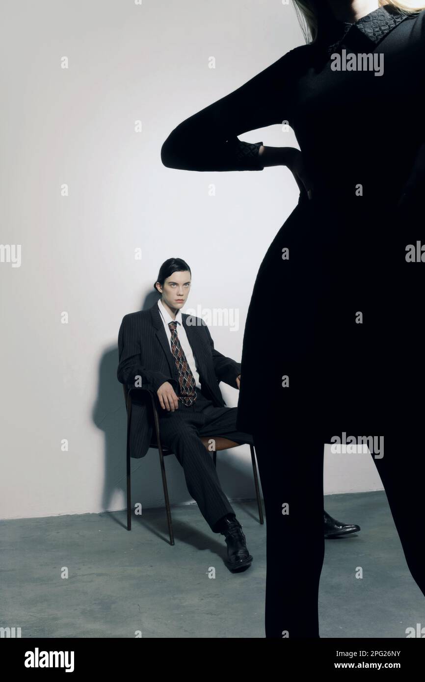 Women on gray background, masculine and feminine Stock Photo - Alamy