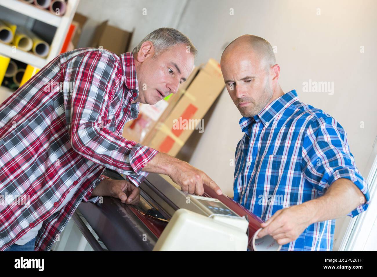 Printing press and workers hi-res stock photography and images - Alamy
