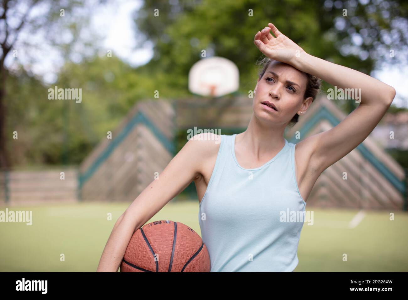side view of female basketball player taking a break Stock Photo - Alamy