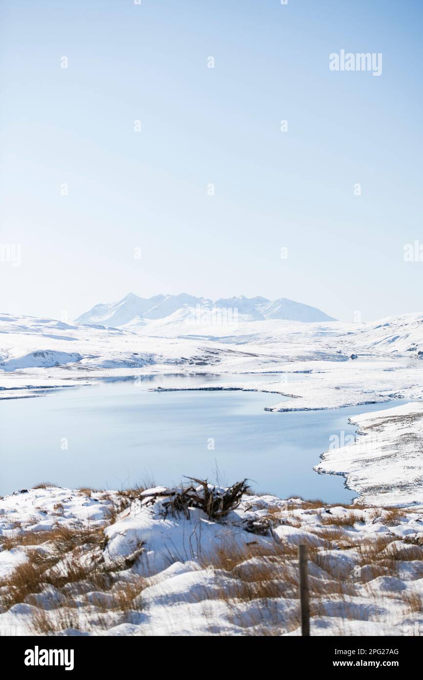 Lake view on snowy Isle of Skye in Scottish Highlands Stock Photo - Alamy