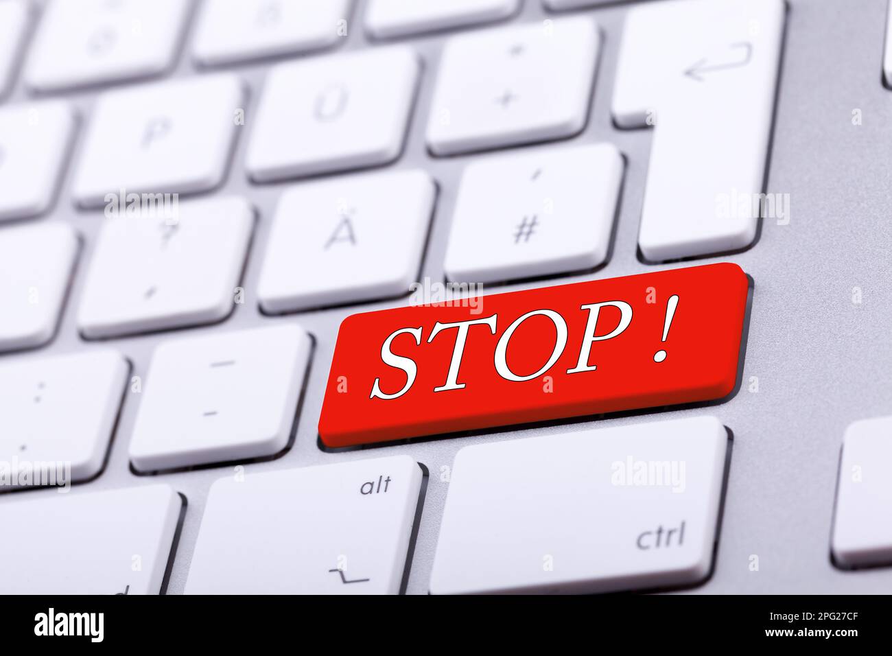 Aluminium keyboard with STOP word in red. Studio photo. Standard ...