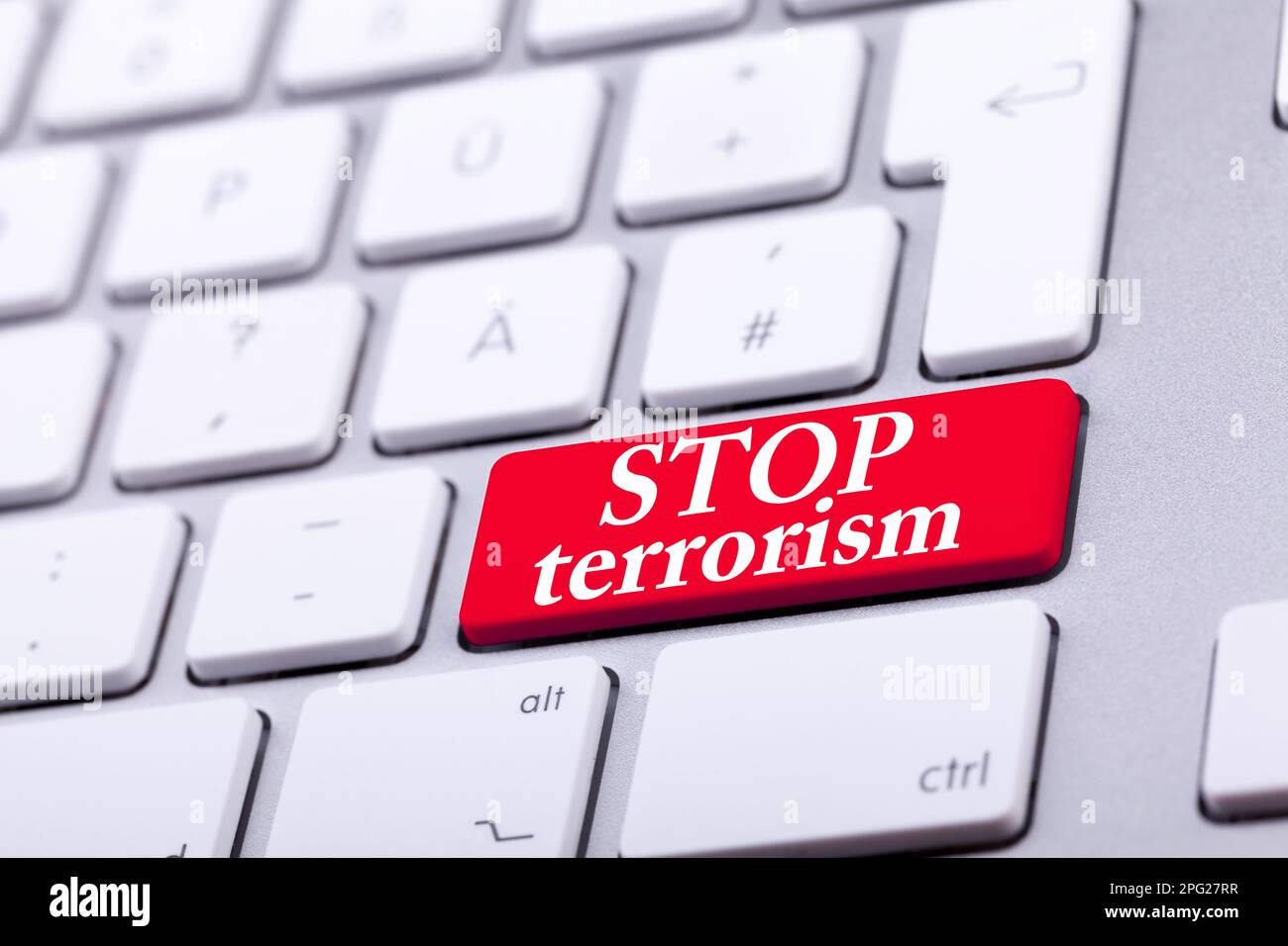 Keyboard with red button and stop terrorism word on it. Stop the war ...
