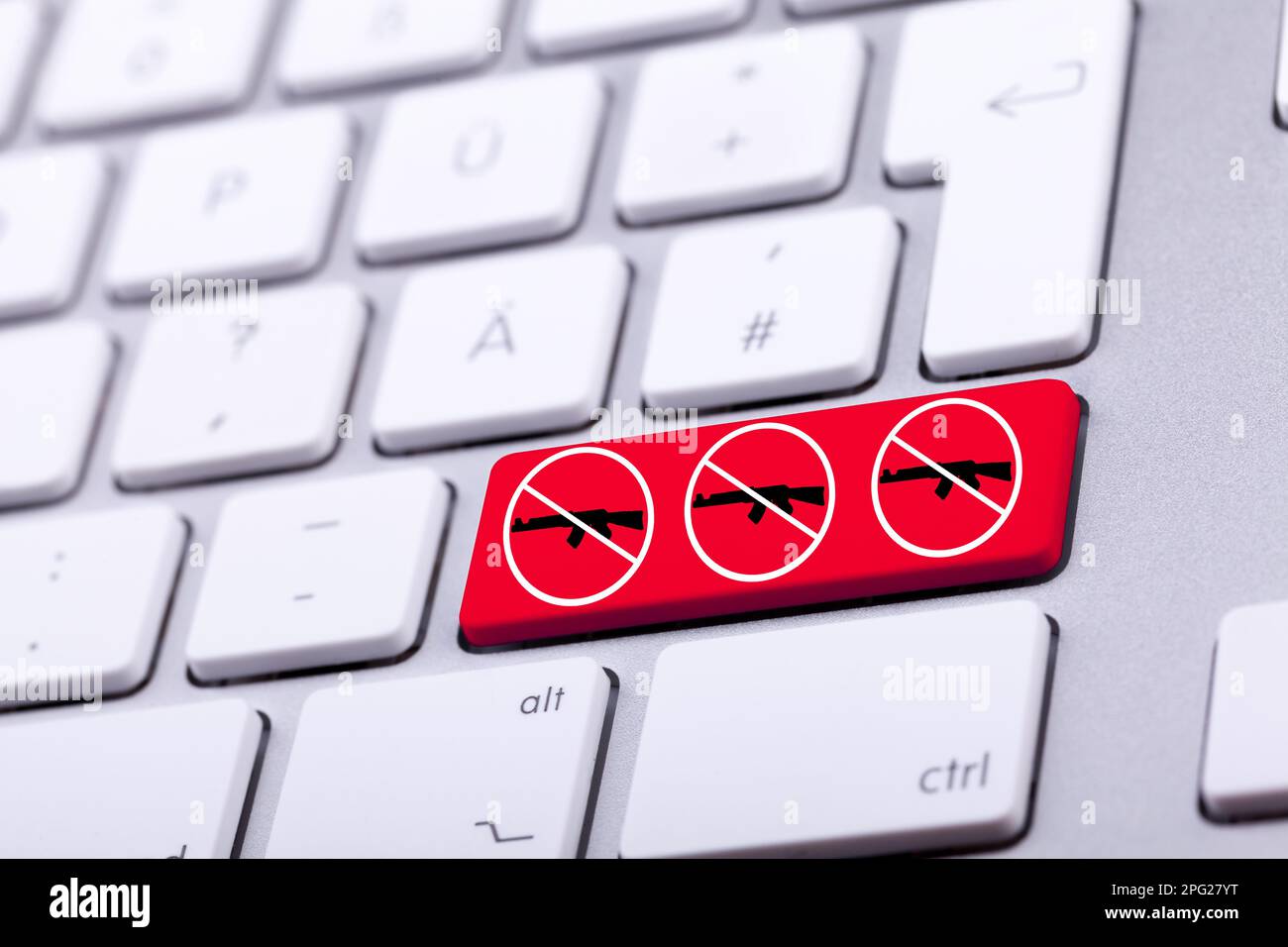 Keyboard with three no gun signs on red button. Stop the war and abuse ...