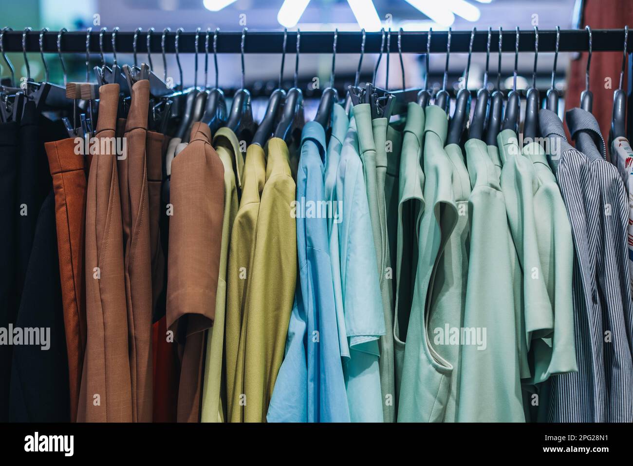 Jackets hanging in wardrobe hi-res stock photography and images - Alamy