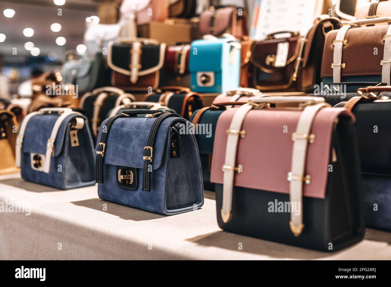 Women's stylish handbags collection in different colors with straps on ...