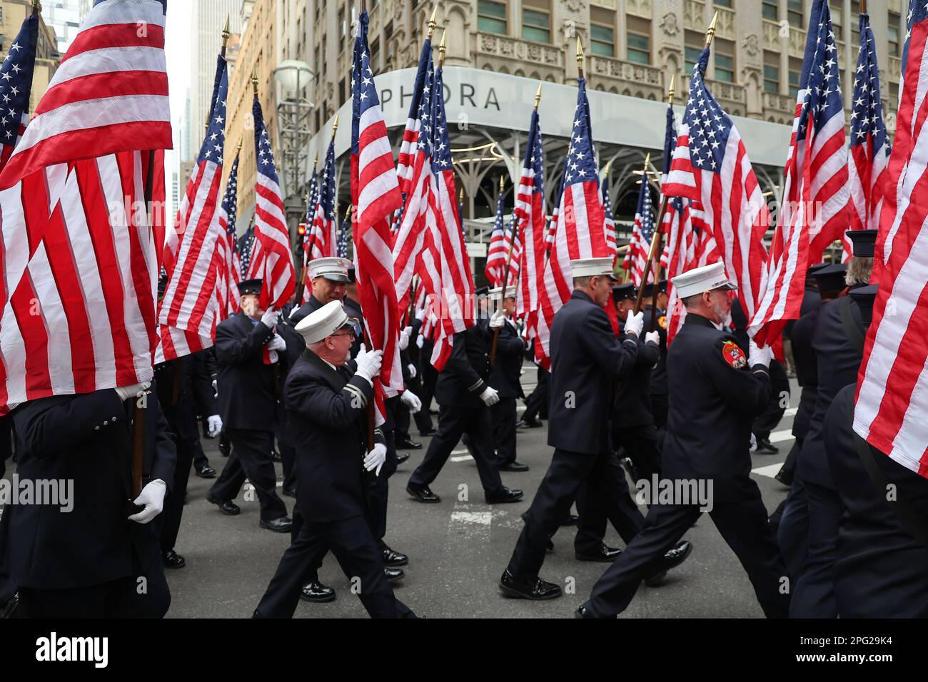 Members of the New York City Fire Department Color Guard carry flags ...