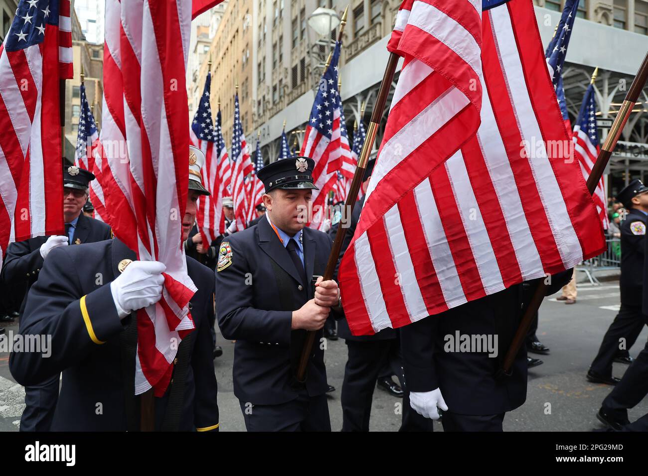 Members of the New York City Fire Department Color Guard carry flags ...