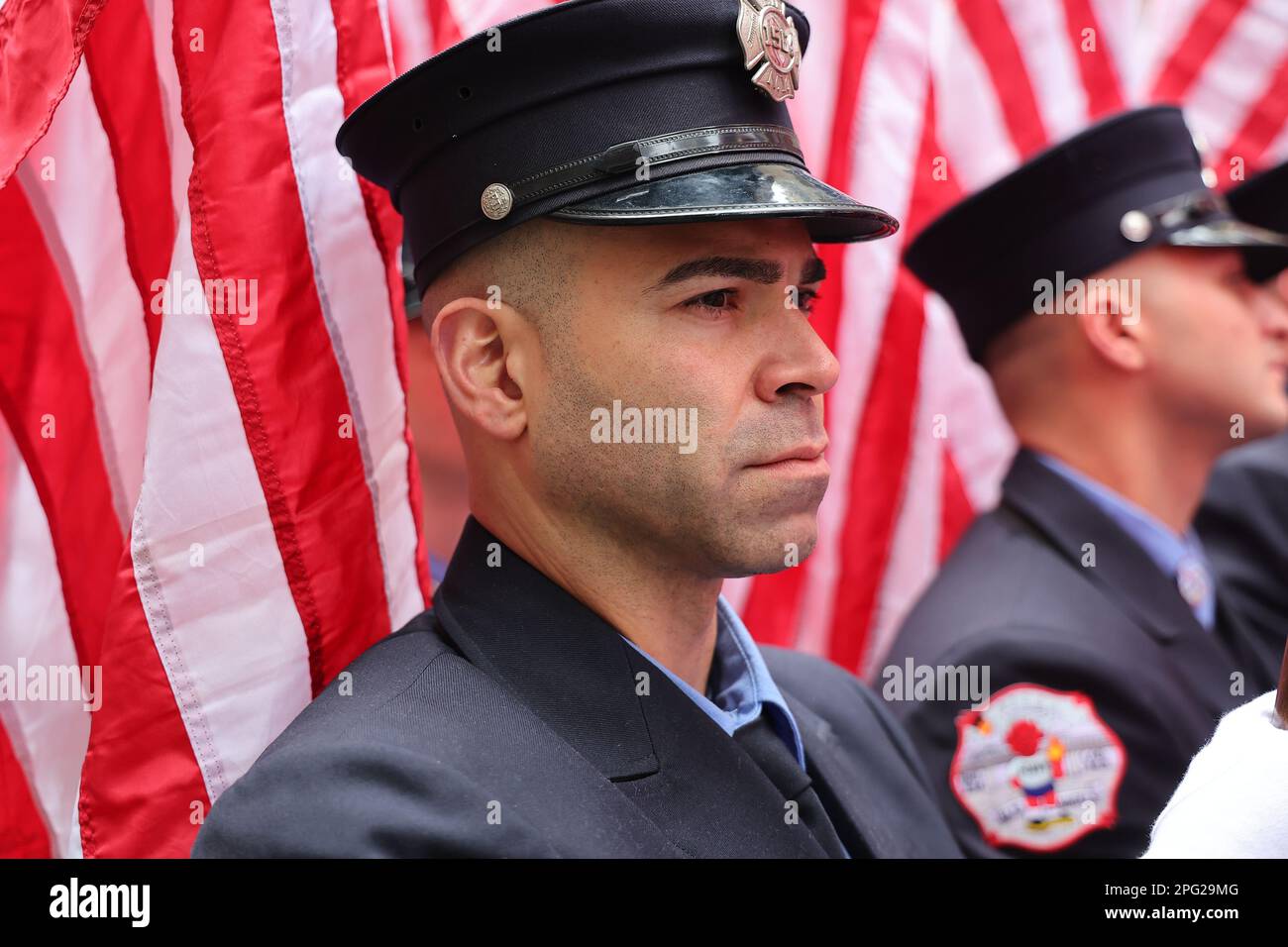 Members of the New York City Fire Department Color Guard carry flags ...