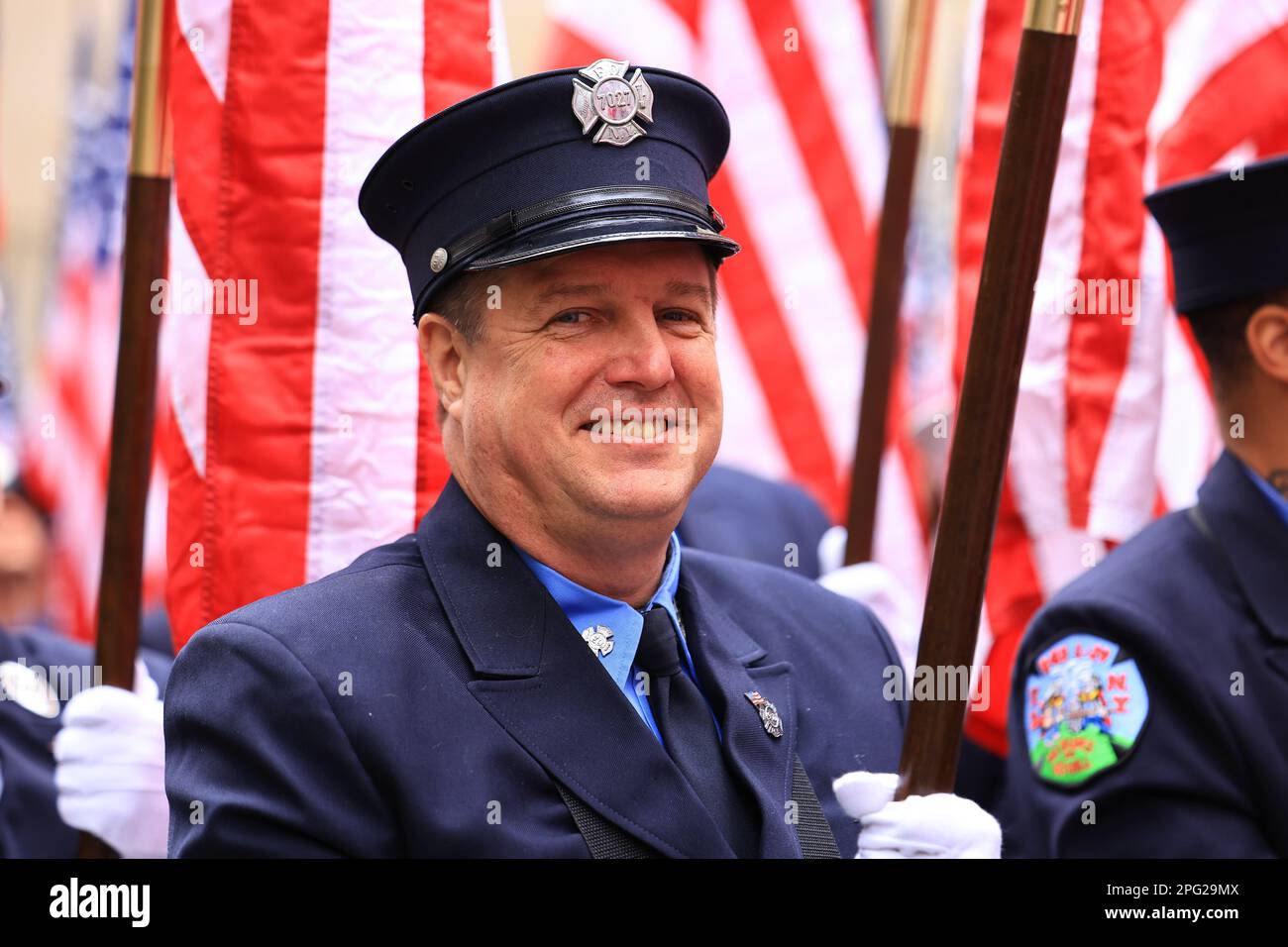 Members of the New York City Fire Department Color Guard carry flags ...
