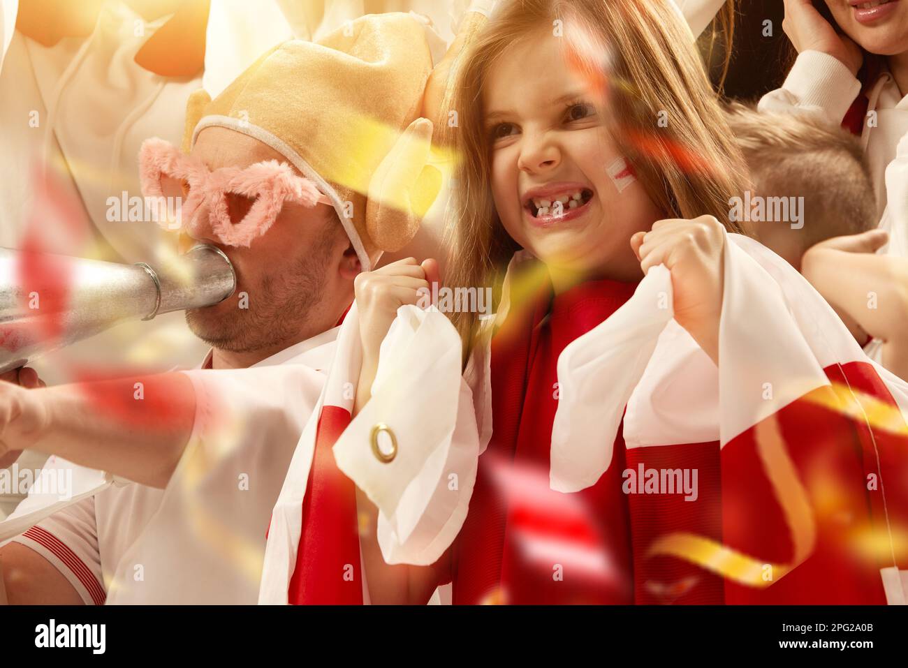 Little girl, child emotionally watching football match a stadium with ...