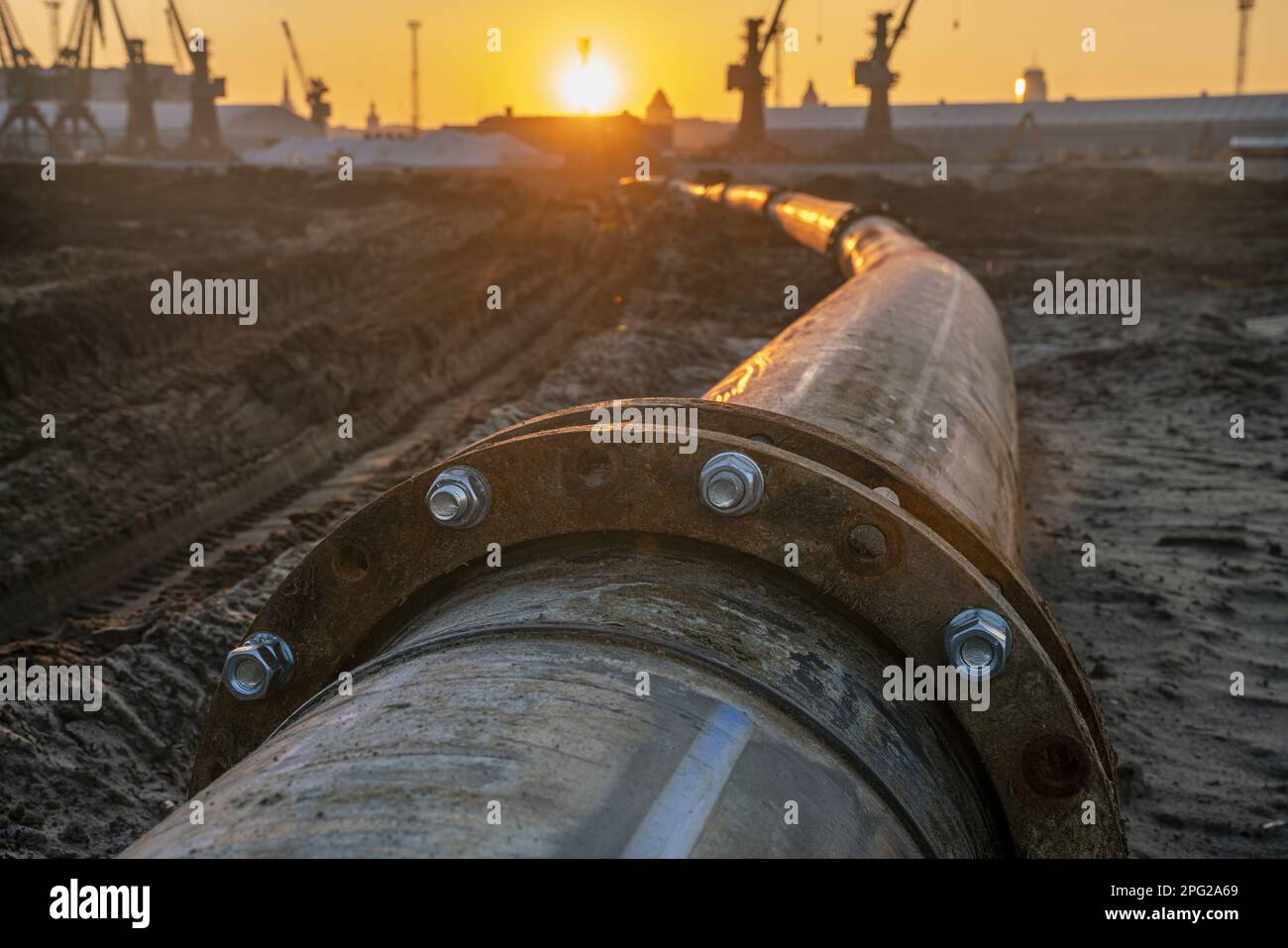 Metal pipeline in industrial area during sunset Stock Photo - Alamy