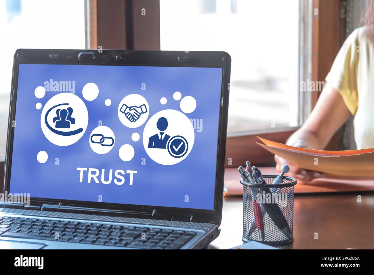 Laptop screen displaying a trust concept Stock Photo - Alamy