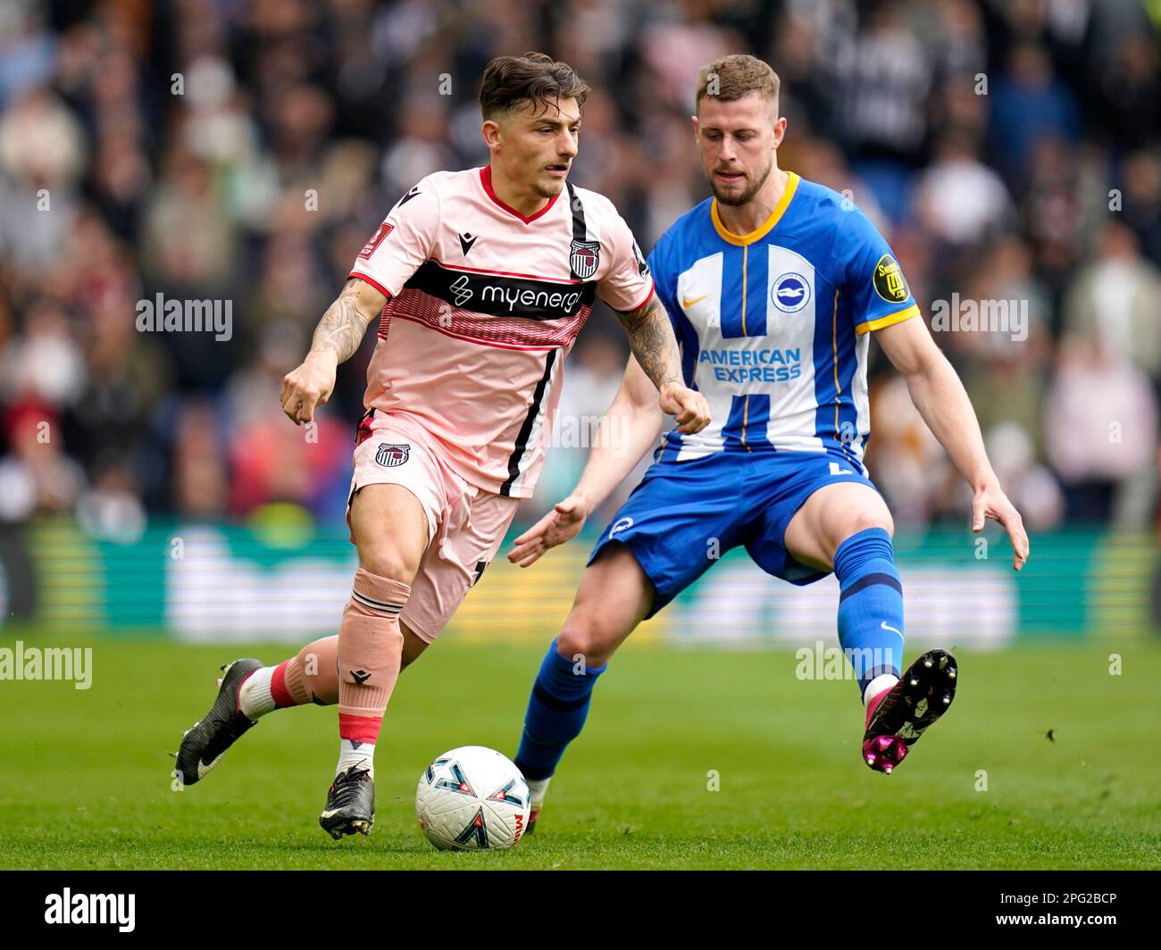 Grimsby Town's Otis Khan (left) and Brighton and Hove Albion's Adam ...