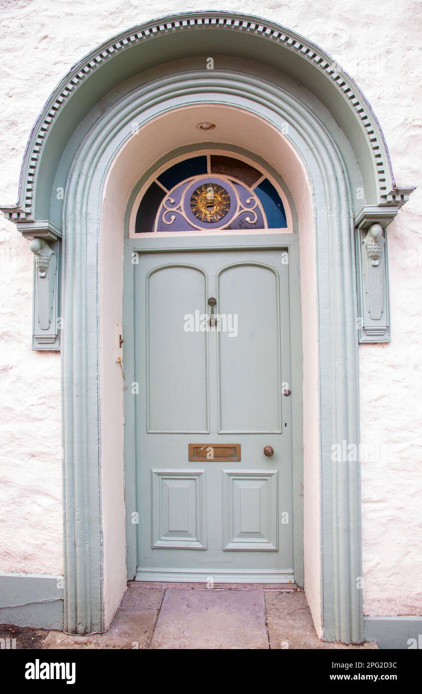 A beautiful door in Lyme Regis, Dorset, England with an arched porch, a ...
