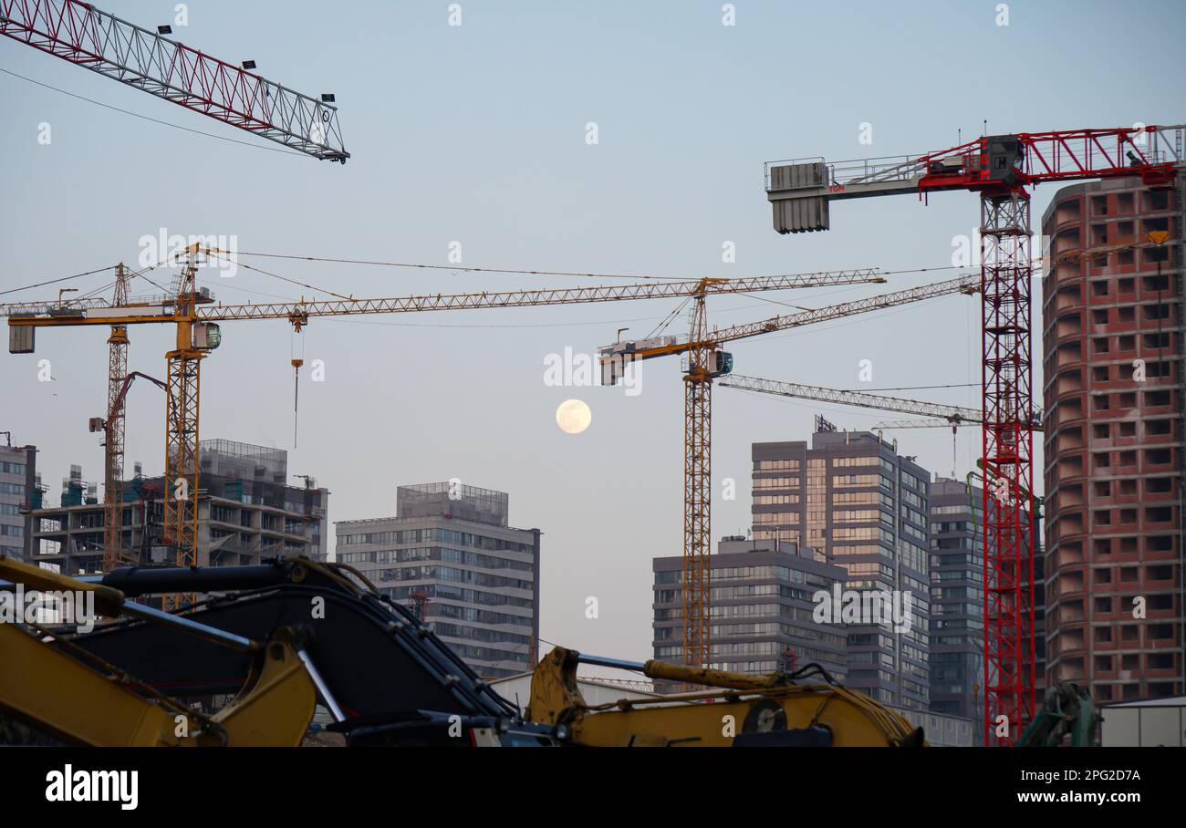 Construction under construction, crane and full moon Stock Photo - Alamy
