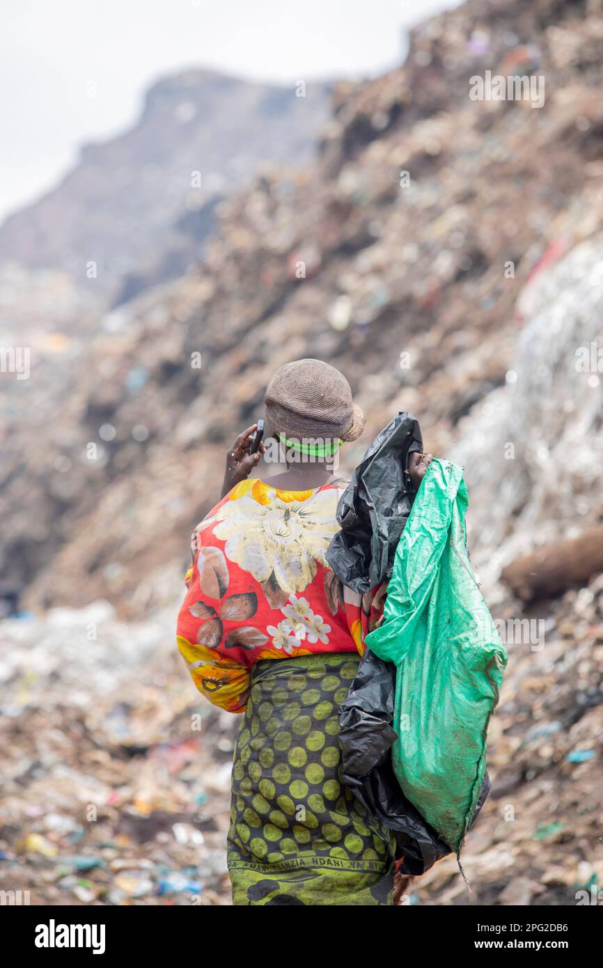 An African woman in a garbage dump earning her own income Stock Photo ...