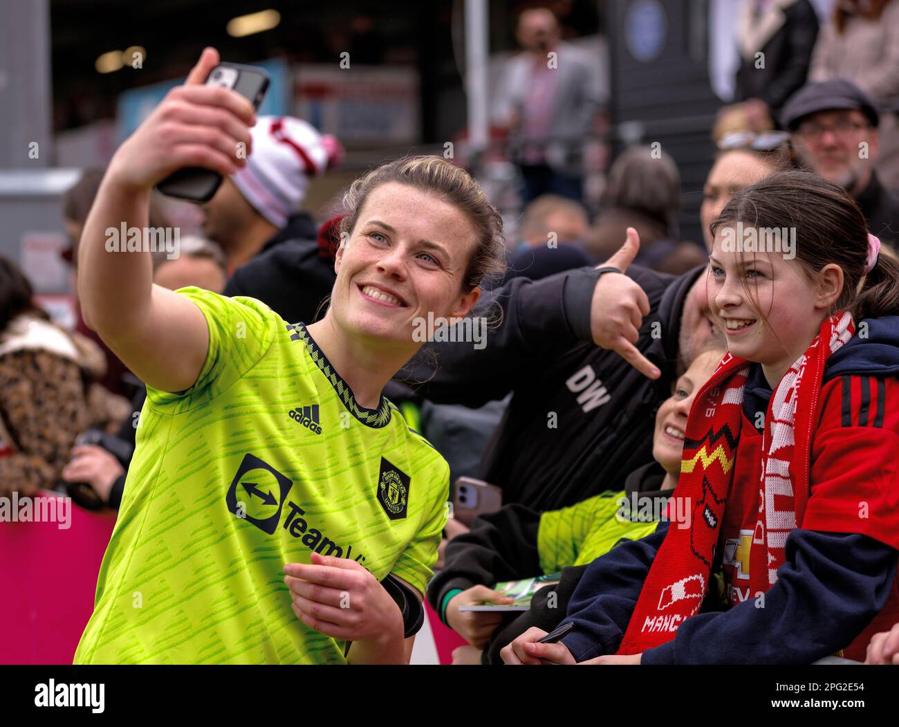 Manchester United's Hayley Ladd poses with fans after the game during ...