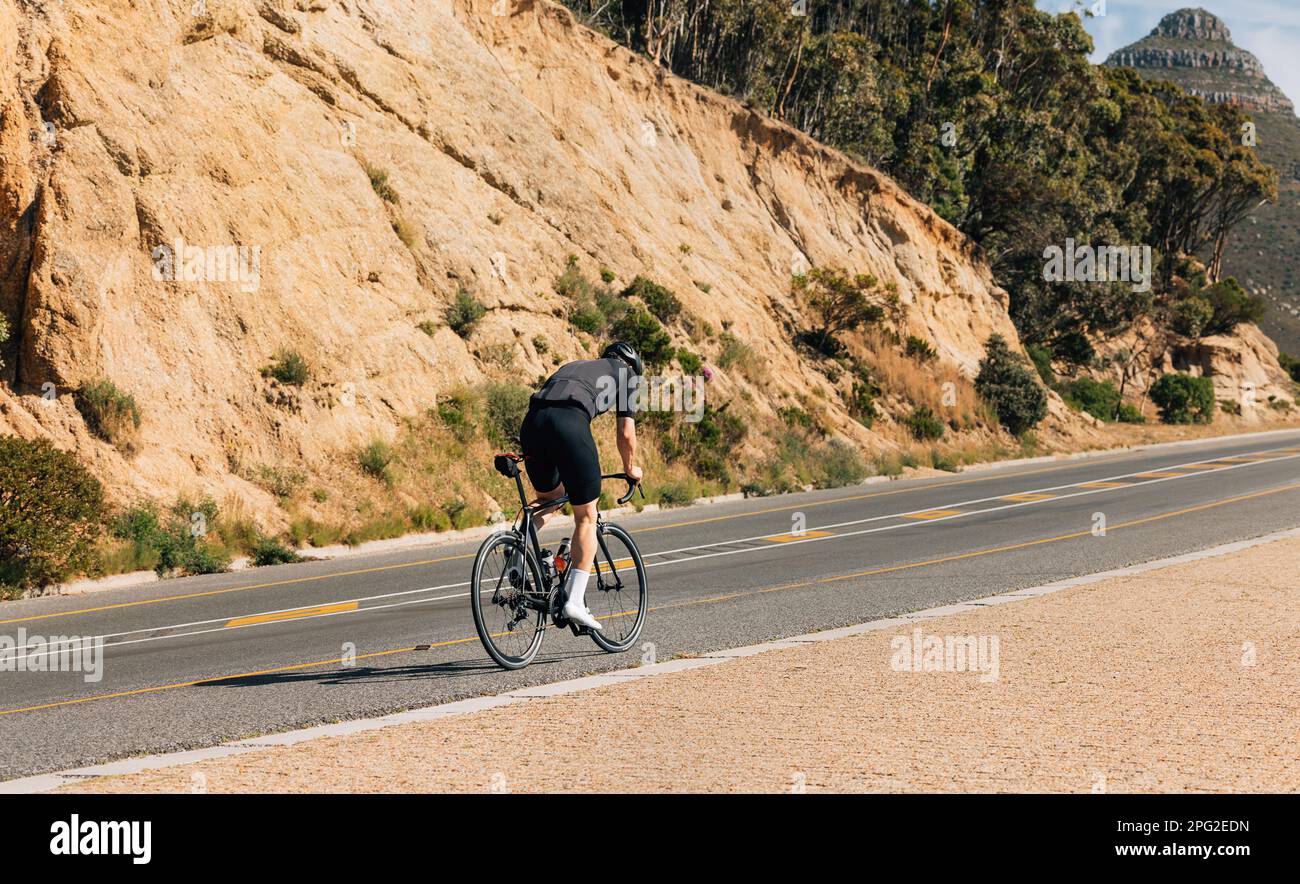 Rear view male cyclist hi-res stock photography and images - Alamy